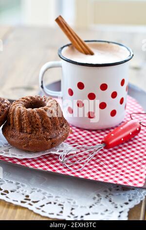 hot cocoa with small chocolate cake Stock Photo - Alamy