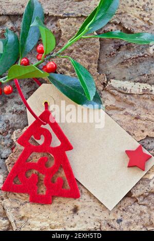 Rustic background with holly branches Stock Photo - Alamy
