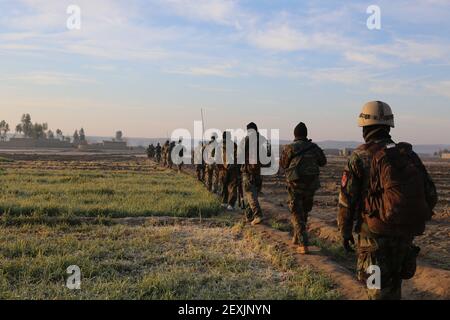 U.S. Army Operational Detachment-Alpha (ODA) members move towards their ...