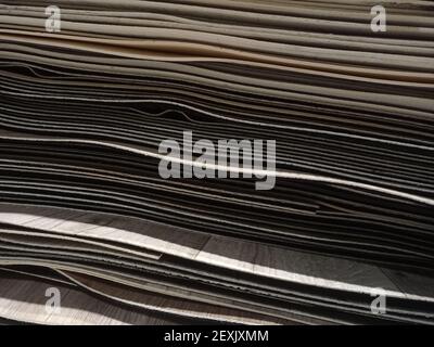 A pile of remnants of pieces of linoleum stacked on top of each other ...