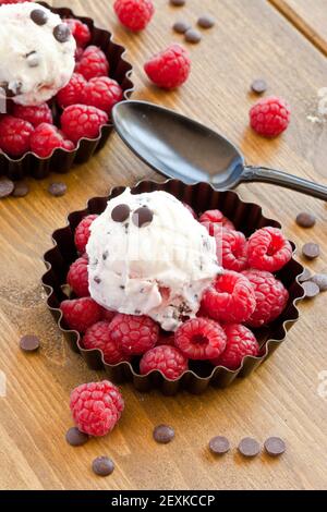 Ice cream with raspberries and chocolate Stock Photo - Alamy