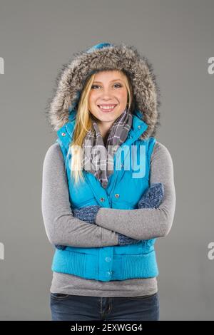 A closeup shot of clothes for cold winter times on the red background ...