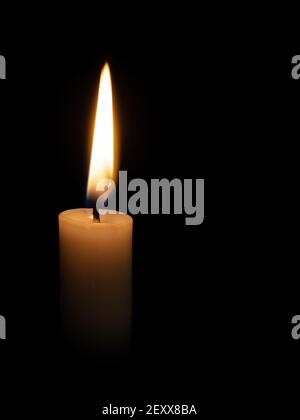 One candle flame at night closeup view Stock Photo - Alamy