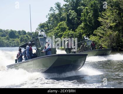 A US Navy special forces Riverine Command Boat conducts a patrol June ...