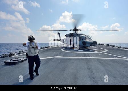 A flight deck crewmen aboard the guided missile cruiser USS BIDDLE (CG ...