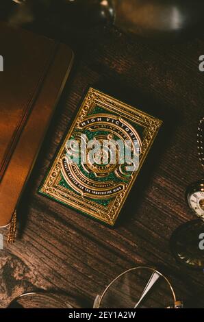 Vintage playing cards in gold and black showing four fours on a white ...