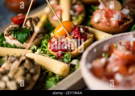 Spanish pinchos: Skewer snacks made of grilled bread with roasted and ...