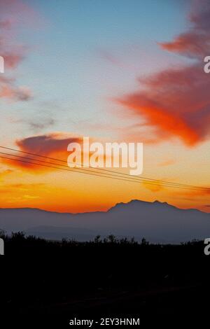 Mountain in morocco africa current cables and red sunrise Stock Photo ...