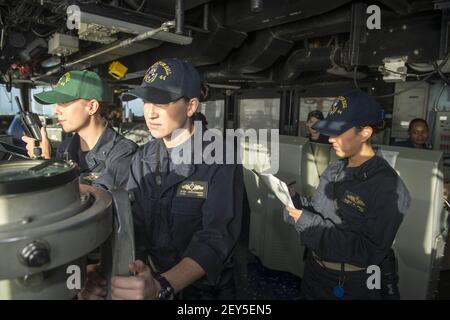A U.S. Marine with 3rd Landing Support Battalion supervises a shipping ...