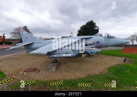 A decommissioned Harrier GR7A sits as a gate guard at the entrance to ...