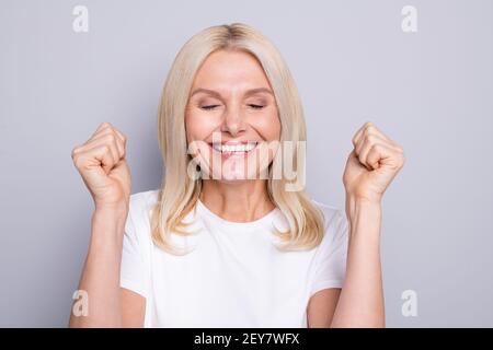 Portrait of pretty positive girl beaming smile arms hold coffee cup ...