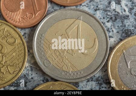 A high angle shot of different euro coins on a table Stock Photo - Alamy