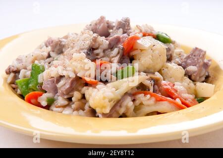creamy lamb risotto with fresh seasonal vegetables Stock Photo - Alamy