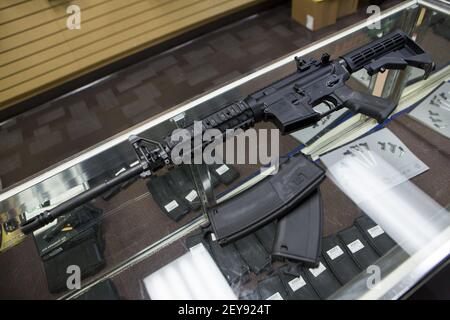 Assault rifle (M4A1) with ammunition on camouflage uniform,and military ...