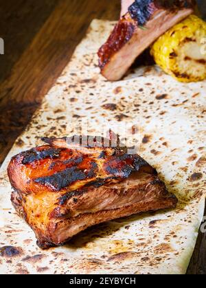 Grilled pork ribs with herbs Stock Photo - Alamy