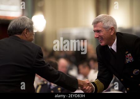 U.S. Navy Commander Kirk S. Lippold poses for photographs after the ...