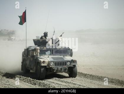U.S. Marines assigned to 4th Marine Regiment lay out cammie netting ...