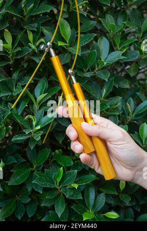 Hand of woman holding a speed jump rope, stock photo Stock Photo - Alamy