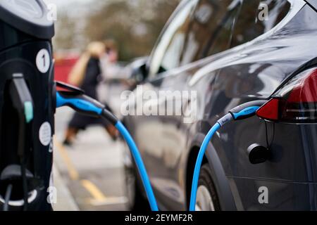 A Tesla car using a Source London EV charging point, London. Picture ...
