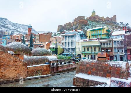 Tbilisi, Georgia - 24 February, 2021: Old Tbilisis with covered snow ...