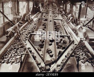 Sorting coal at a coal mine Stock Photo - Alamy