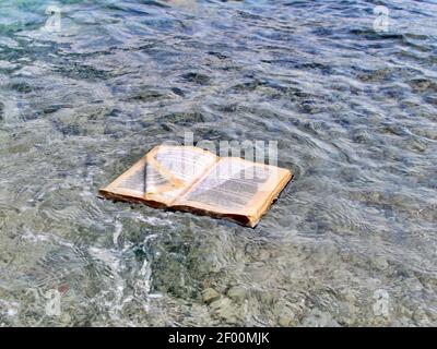 book drifting on water Stock Photo - Alamy