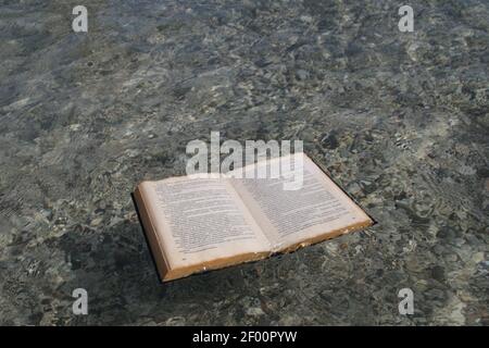 book drifting on water Stock Photo - Alamy