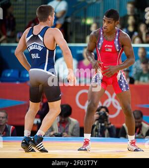 USA's Ellis Coleman (red) wrestles Bulgaria's Ivo Angelov (blue) during ...