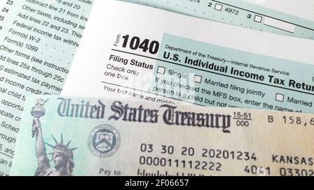 Stimulus economic tax return check and and 1040 Form with dollars Stock ...