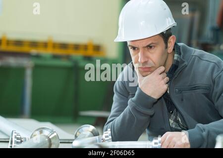 Portrait of stressed despair engineer closed face by two hands Stock ...