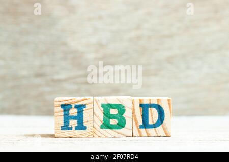 Wood letter in word HBD (Abbreviation of happy birthday) on artificial ...