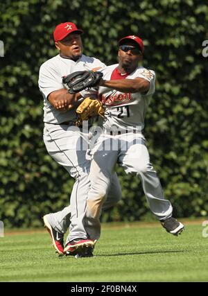 Houston Astros' Michael Bourn, left, slides into home plate to score ...