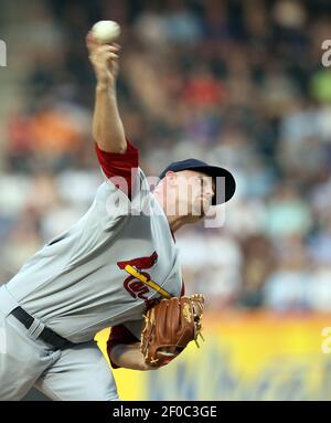 St. Louis Cardinals' Kyle McClellan sits in the dugout after giving up ...