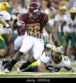 Minnesota running back Duane Bennett (22) runs for seven yards against ...