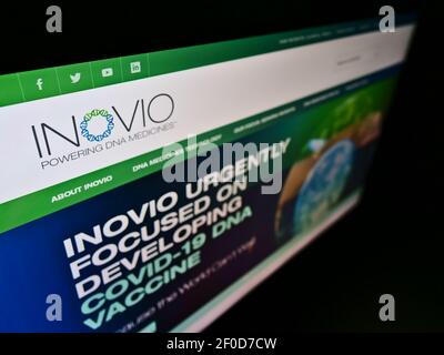 Inovio company logo on a website with blurry stock market developments ...