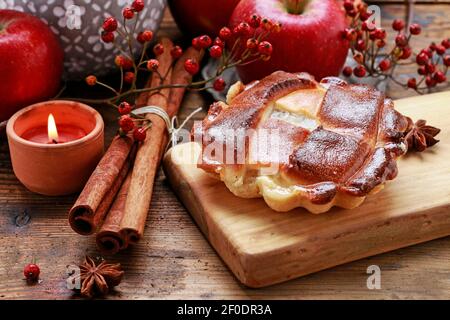 Traditional apple pie and autumn decorations around it. Party dessert ...