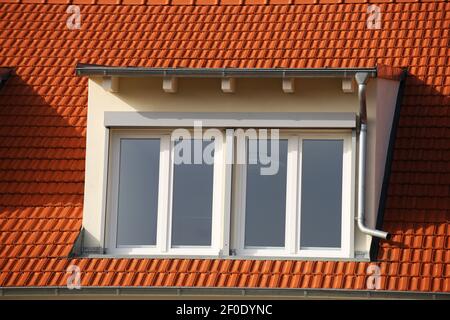 Newly tiled roof with large dormer with standing seam cladding Stock ...