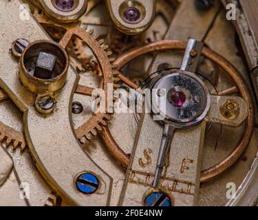 Macro image of the internal working of a pocket watch showing the ...