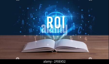 ROI inscription coming out from an open book, digital technology ...