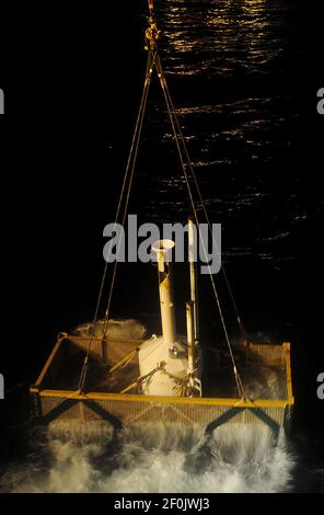 The containment vessel is lowered into the Gulf of Mexico at the site ...