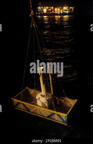 The containment vessel is lowered into the Gulf of Mexico at the site ...