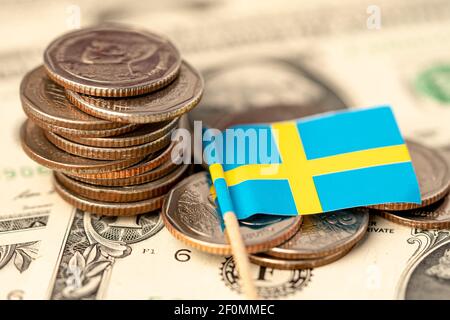 Stack of coins with Sweden flag on USA America dollar banknotes Stock ...