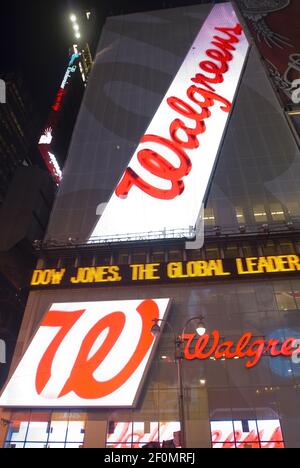 A giant illuminated sign on One Times Square in New York advertises the ...