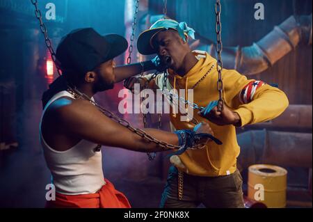 Two rappers posing, performing in cool studio Stock Photo - Alamy