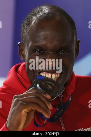 Belgian Isaac Kimeli celebrates on the podium after the 5000m men final ...
