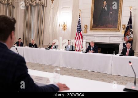 President Donald Trump listens during a cabinet meeting at the White ...