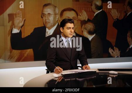 Al Jazeera satellite TV anchors Habib Ghribi and Lina Zahreddine read a ...