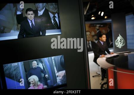 Al Jazeera satellite TV anchors Habib Ghribi and Lina Zahreddine read a ...