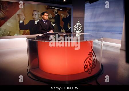 Al Jazeera satellite TV anchors Habib Ghribi and Lina Zahreddine read a ...