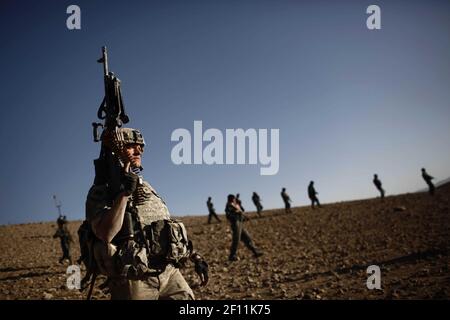 A US Army soldier with the 82nd Airborne Division sits on the stairs of ...